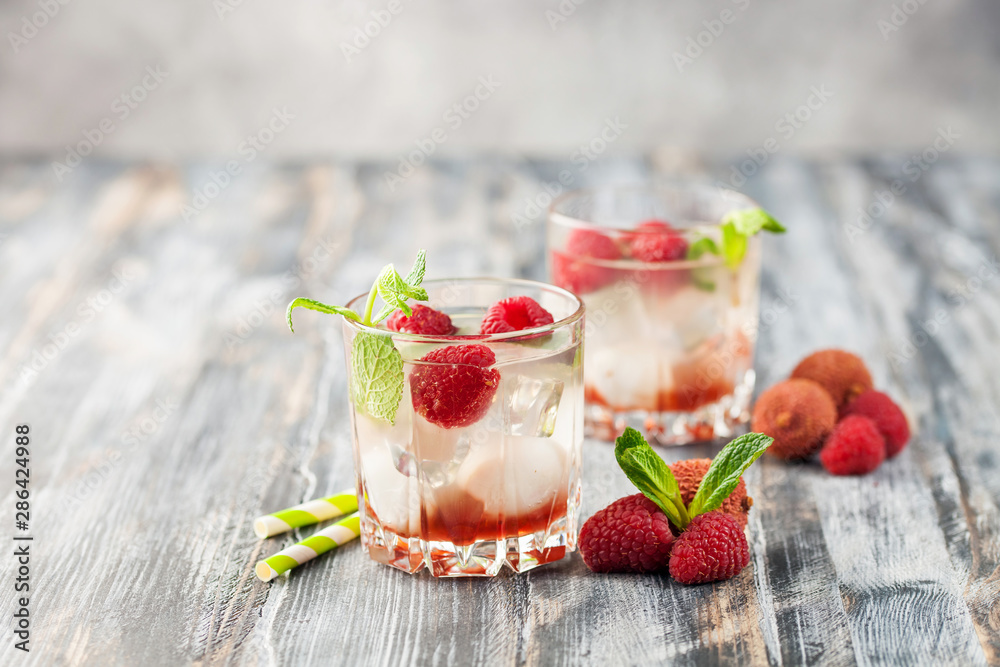 Cold lychee and raspberry cocktail. Stock Photo | Adobe Stock