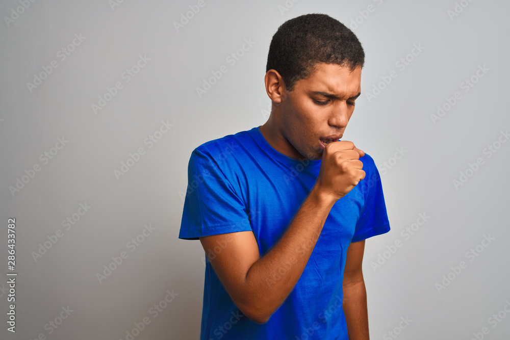Young handsome arab man wearing blue t-shirt standing over isolated ...