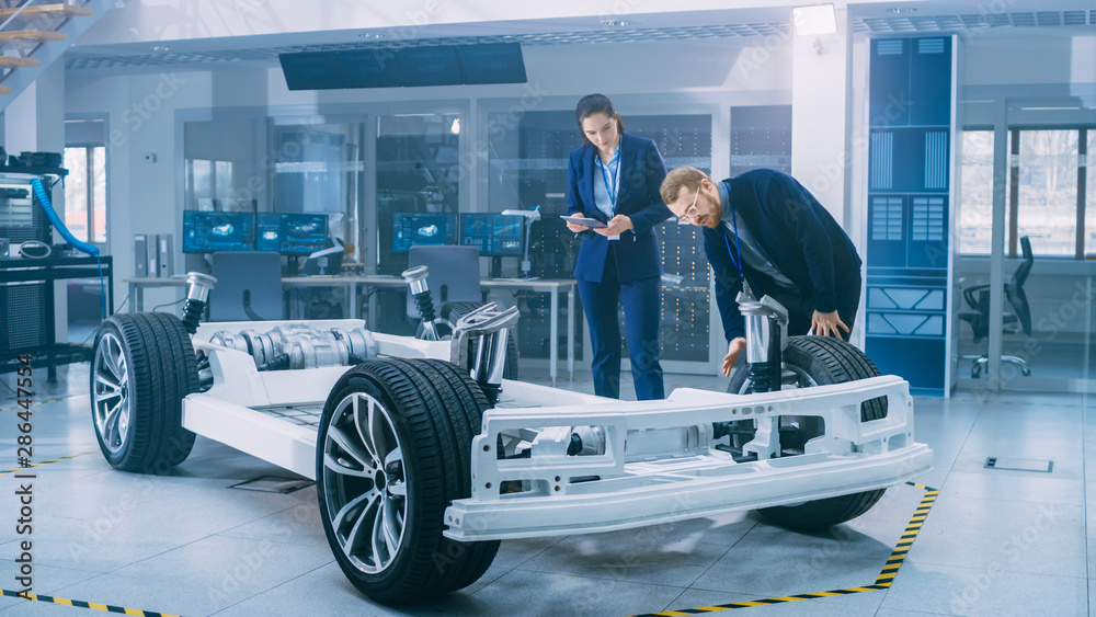 Automotive Design Engineers Working on Electric Car Chassis Prototype ...