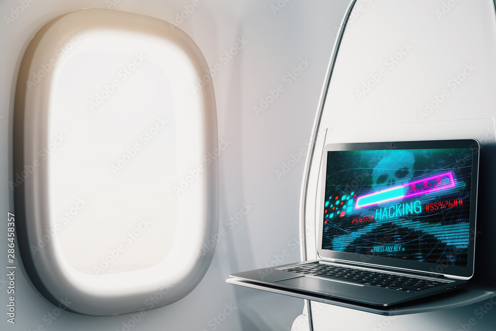 Laptop closeup inside airplane with hacking theme pic on screen. Data ...