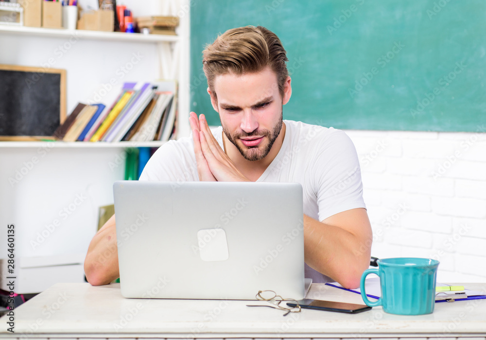 Handsome man use modern technology. Improve knowledge. Student learn ...