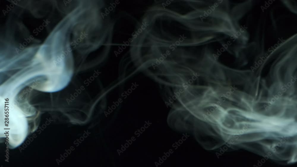 Vidéo Stock Vertical video screensaver - Trickle silvery smoke slowly ...