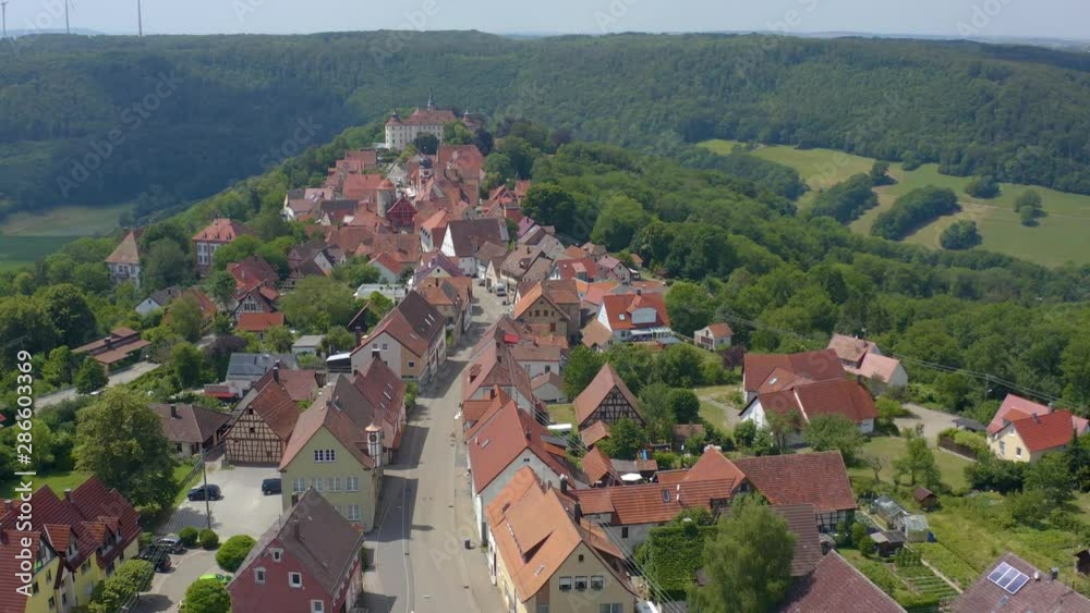 Aerial view of the village and castle Langenburg in Germany. Pan to the ...