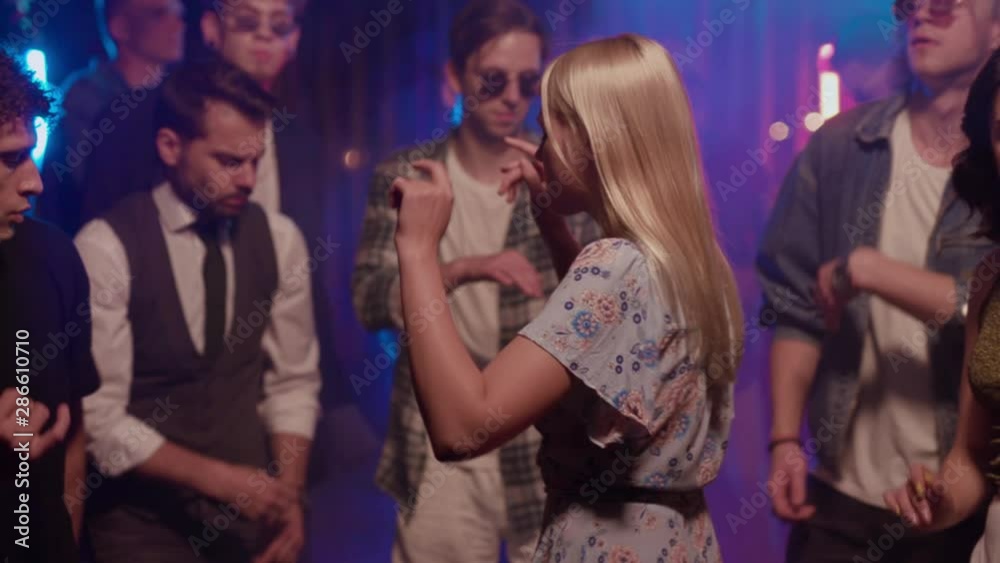 Appealing blonde guy dancing off cheering up the crowd clapping hands ...