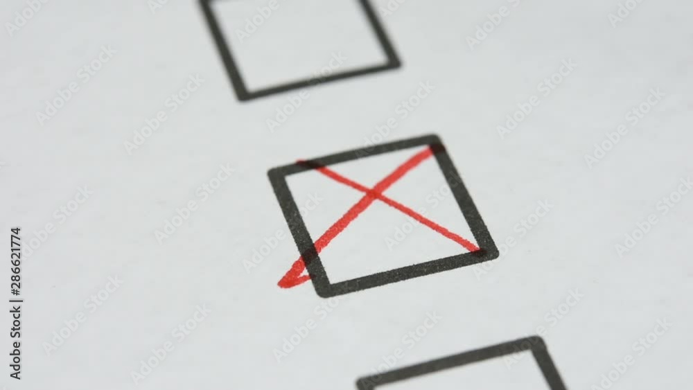 red pen make a x cross check mark sign in check box list on white paper ...