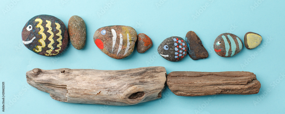 Happy family concept - drawing stone fish on blue background, Creative ...