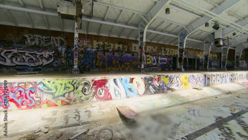Creative colorful graffiti on wall and swimming pool in old abandoned ...