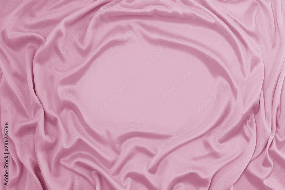 Photograph of silk fabric, color pink. The texture of silk fabric ...