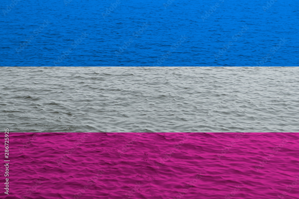 heterosexual flag, LGBT juxtaposition rainbow flag on water texture ...