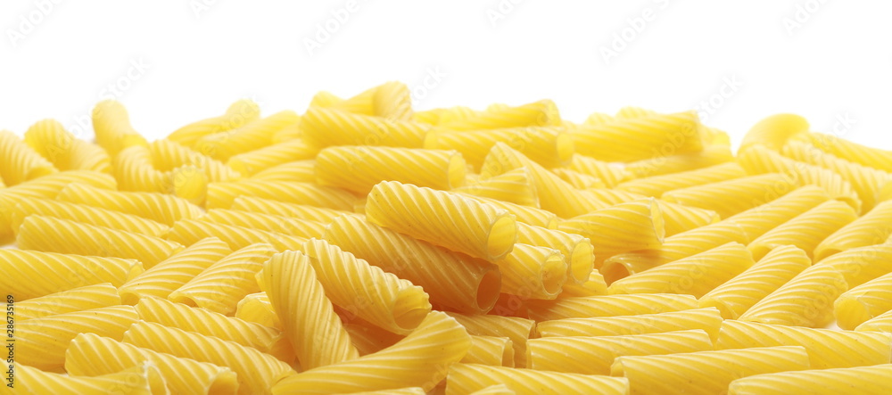 Uncooked short tubes shape pasta also known as tortiglioni or ...