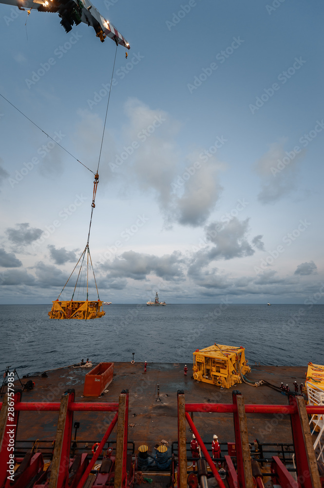 Crane lifter lifting heavy load Stock Photo | Adobe Stock