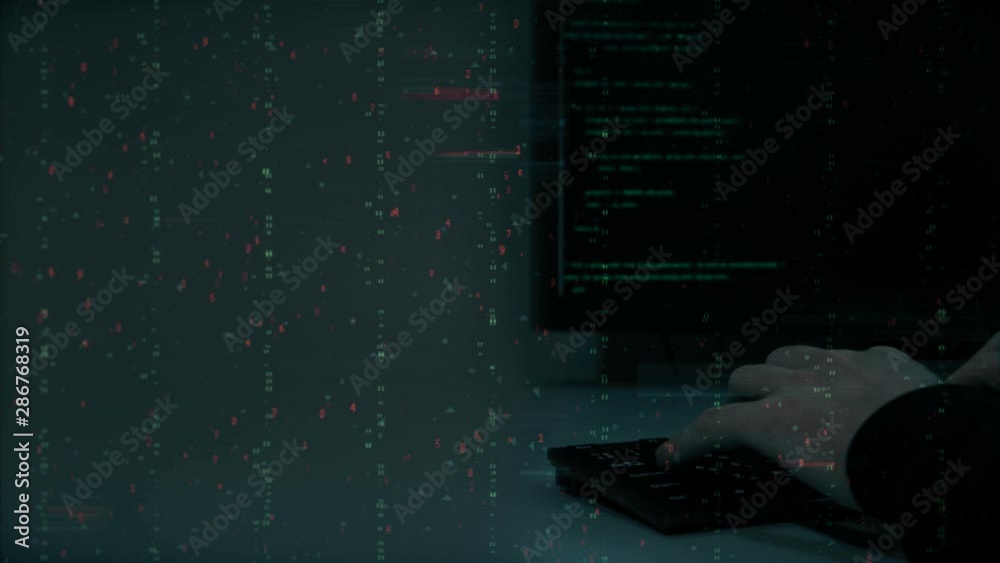 Programmer writes code in a computer terminal, a person hands on ...