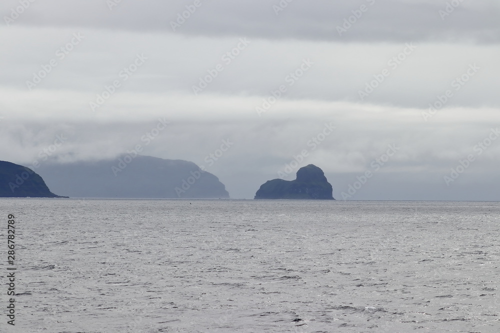 Kamen-Lev Island, Iturup. Coast of Iturup island, the Sea of Okhotsk ...