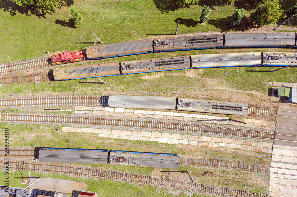 aerial view of a train with locomotive on a railway track. trains at ...