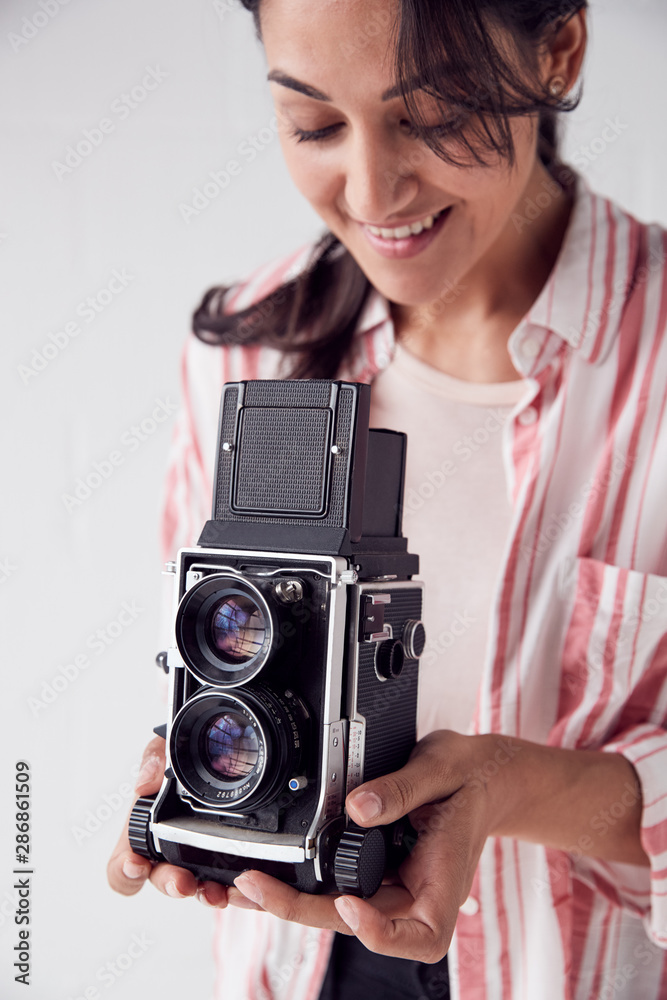 Female Photographer With Vintage Medium Format Camera On Photo Shoot ...
