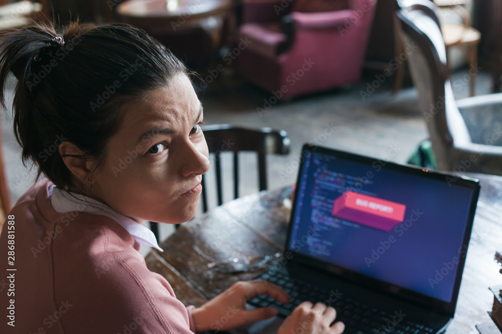 Something went wrong. Very excited girl in front of laptop, with site ...