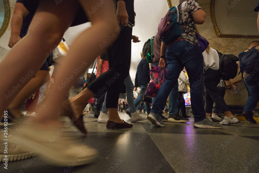 Defocused photography of people legs going in the subway. Concepts of ...