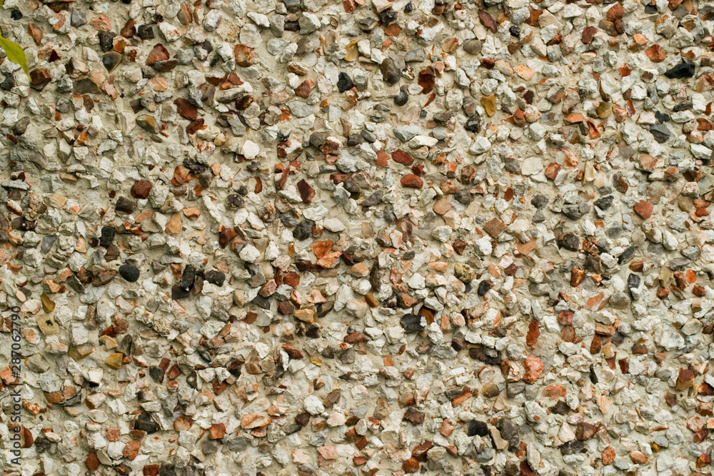 Pebble dash surface mixture of concrete and pebbles applied on building ...