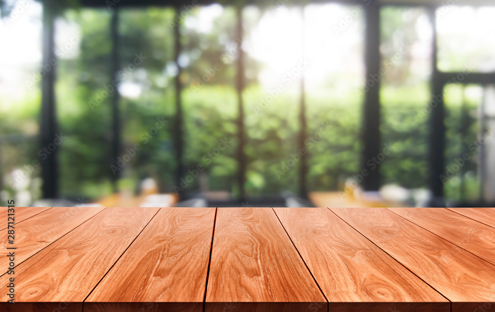 Wood table in blurry background of modern restaurant room or coffee ...