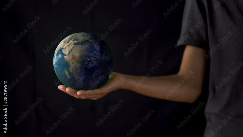 Female hand holding a realistic Earth. Holding the world in your hand ...