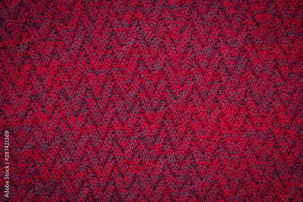 Red seamless knit fabric texture with braids. Repeating machine ...