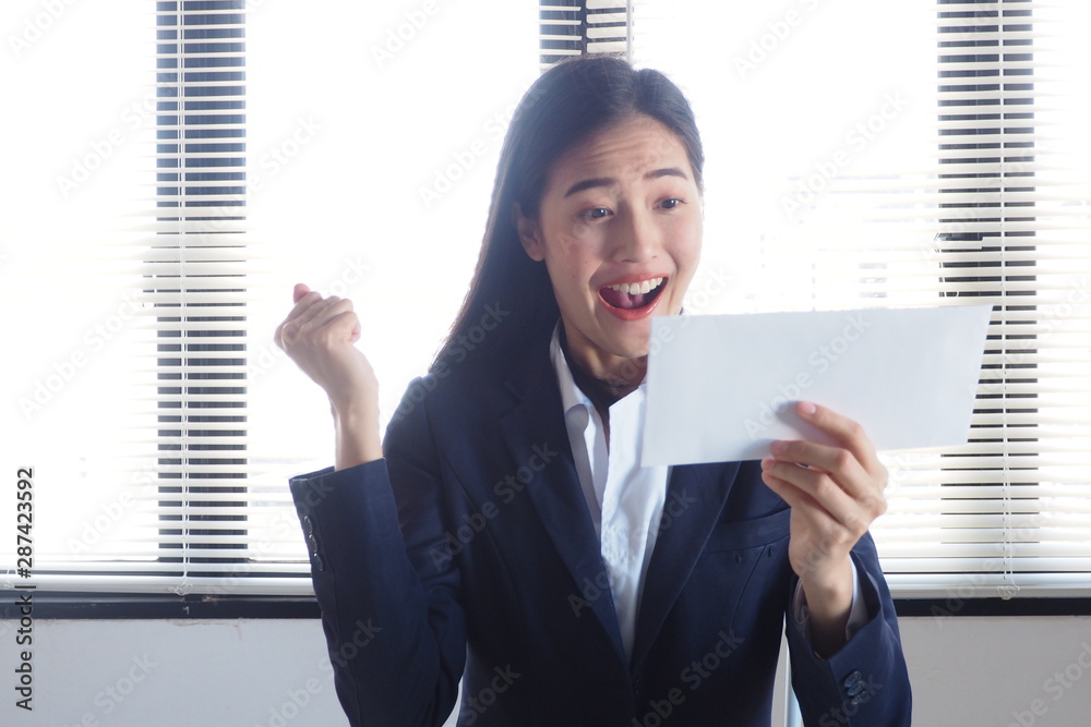 Young active Asian woman is excited with her happy face smiling and ...