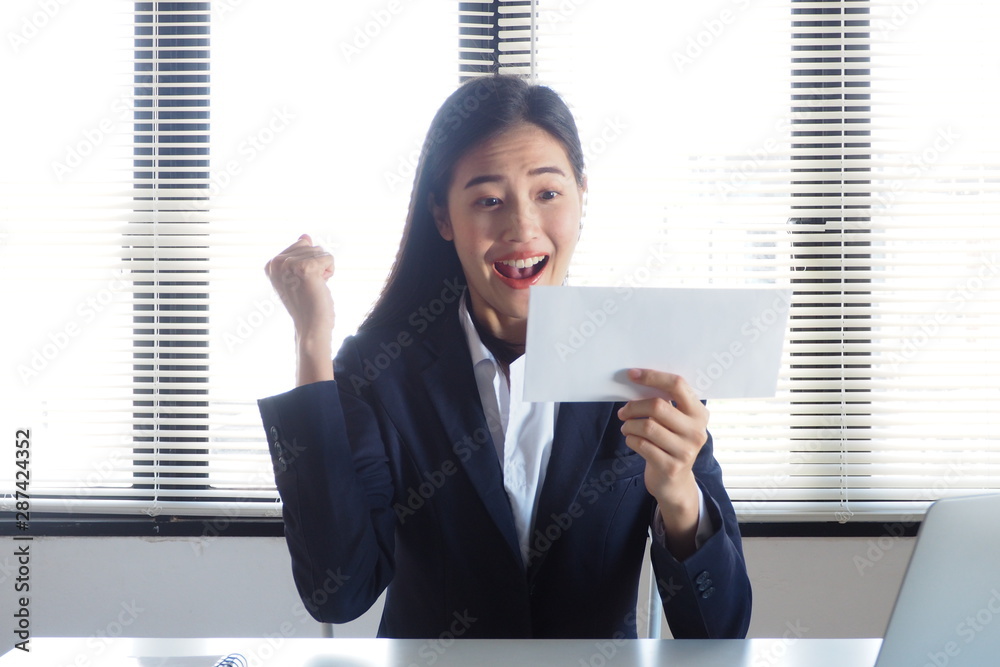 Young active Asian woman is excited with her happy face smiling and ...