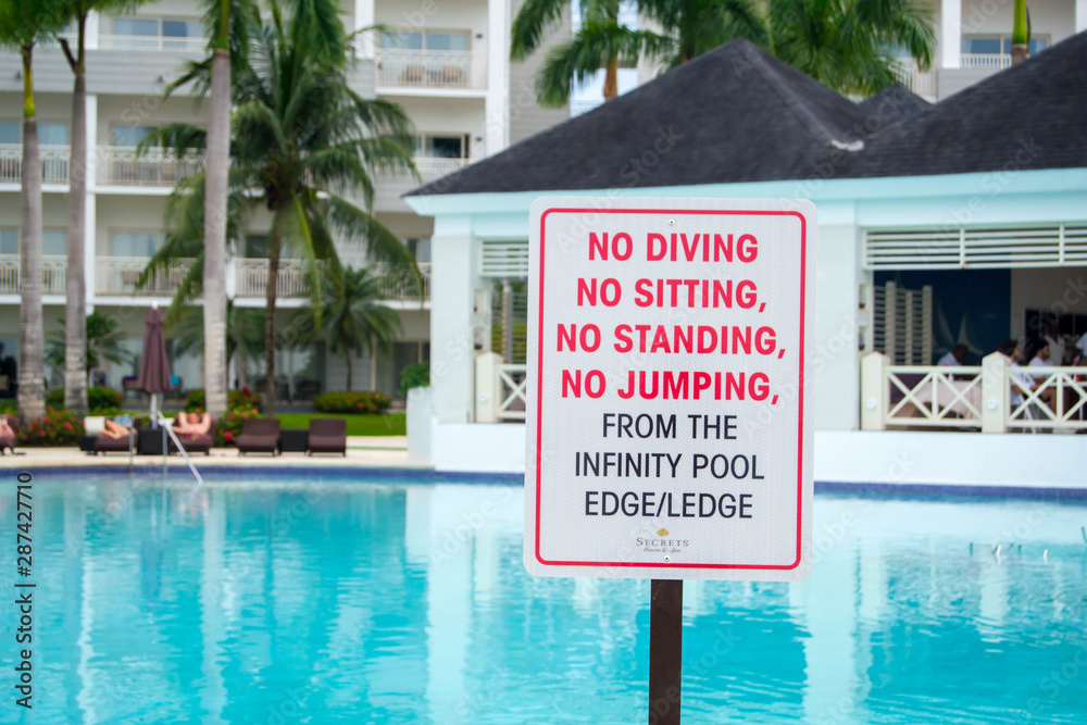 Swimming pool caution sign Stock Photo | Adobe Stock