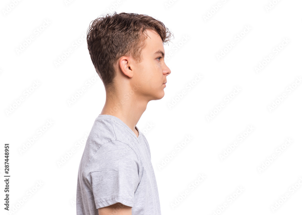 Side view of portrait of teen boy in blank gray t-shirt, isolated on ...
