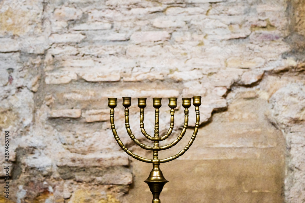 Menorah for 7 candles in an old synagogue Stock Photo | Adobe Stock