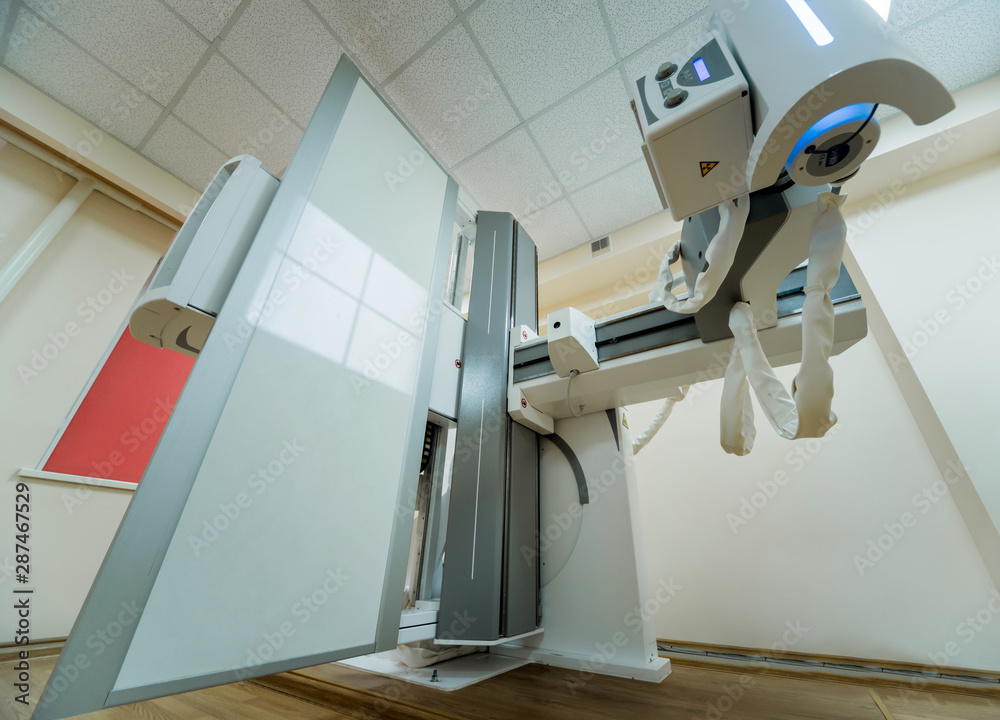 X-ray room in a hospital. Classic ceiling-mounted x-ray system. Stock ...