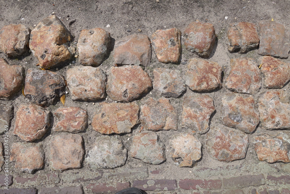 cobblestones combined in a pavement of vowels Stock Photo | Adobe Stock