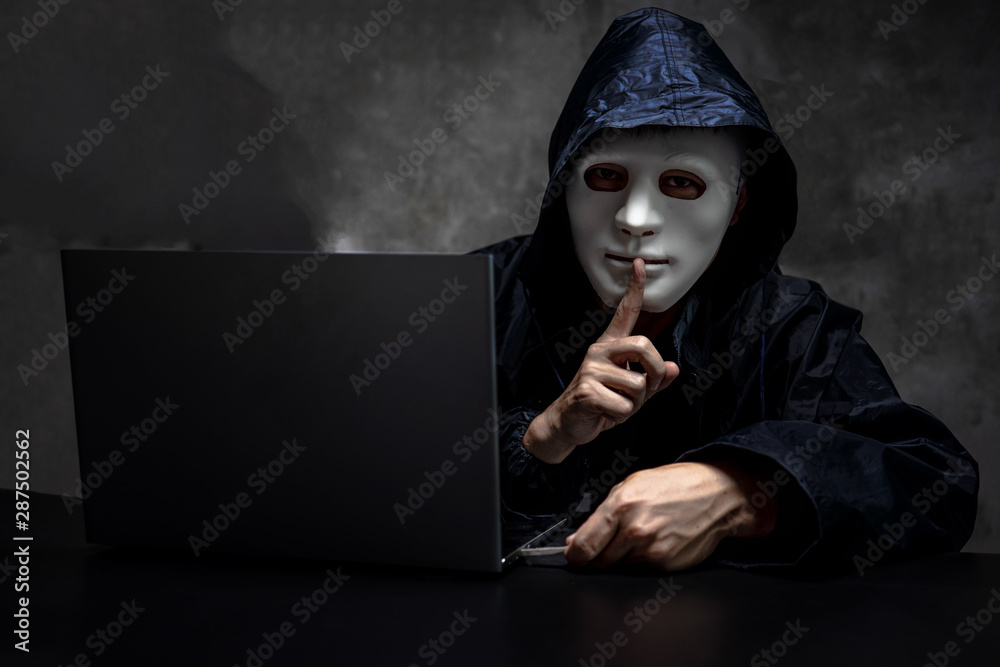 Male hacker hidden face with the mask and hoodie. Obscured dark face ...