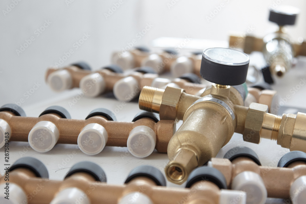 Elements of water conduit and manometers in room Stock Photo | Adobe Stock