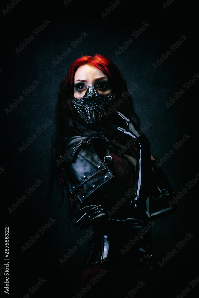 Young Cyborg with black eyes in leather armor Stock Photo | Adobe Stock
