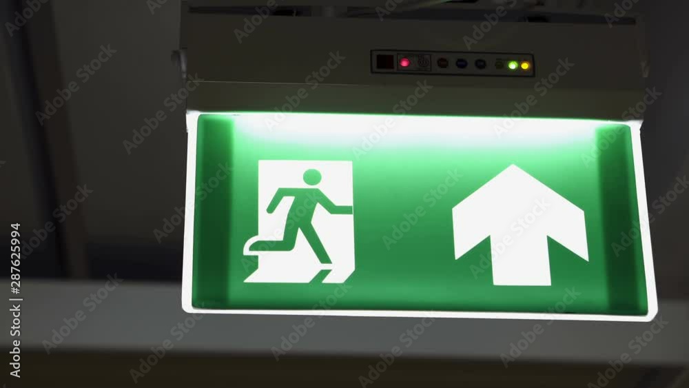 Emergency fire exit sign in doorway office building with siren alarm ...