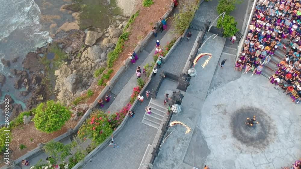 Uluwatu Kecak and Fire Dance stage at Bali amphitheatre, aerial reveal ...