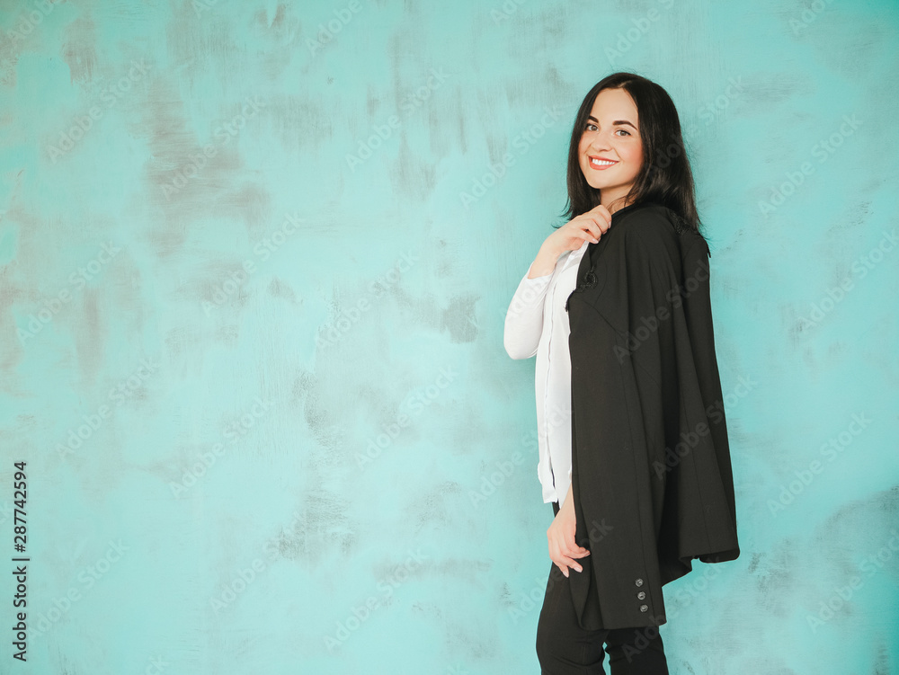 Portrait young beautiful girl in formal dark suit in office. Successful ...