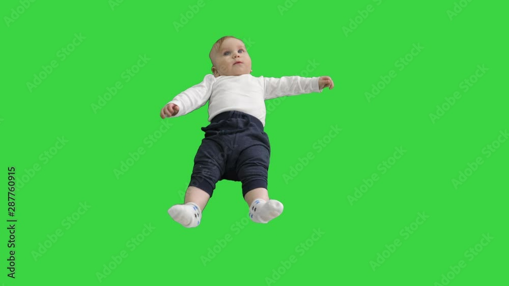 Crying baby boy laying on a Green Screen, Chroma Key. vídeo do Stock ...