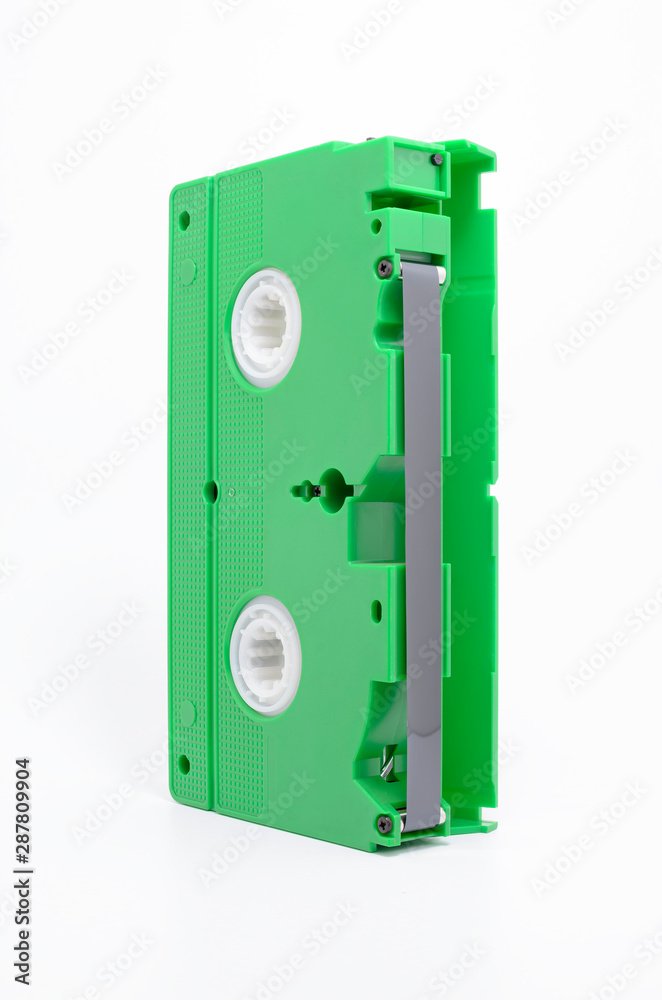 VHS tape on vertical with open cover and the magnetic tape exposed ...