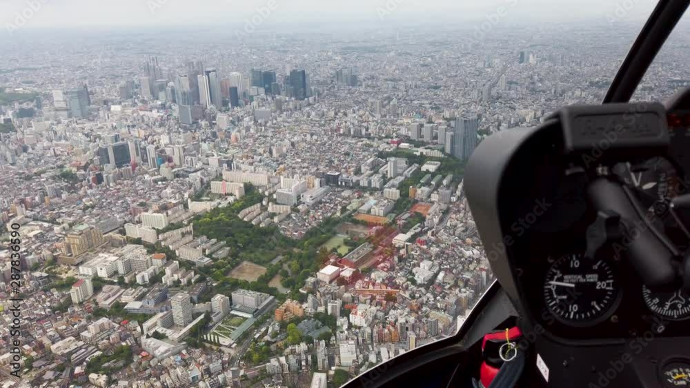 TOKYO, JAPAN. Aerial view of Tokyo with the helicopter controls. City ...