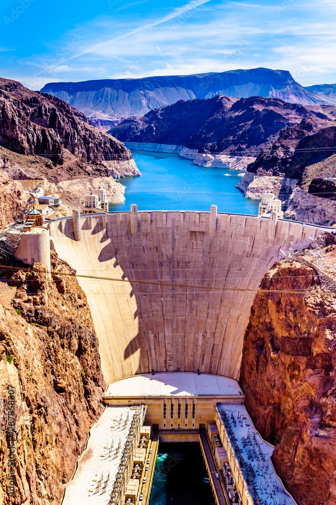 Frontal view of the Hoover Dam, a concrete arch dam in the Black Canyon ...