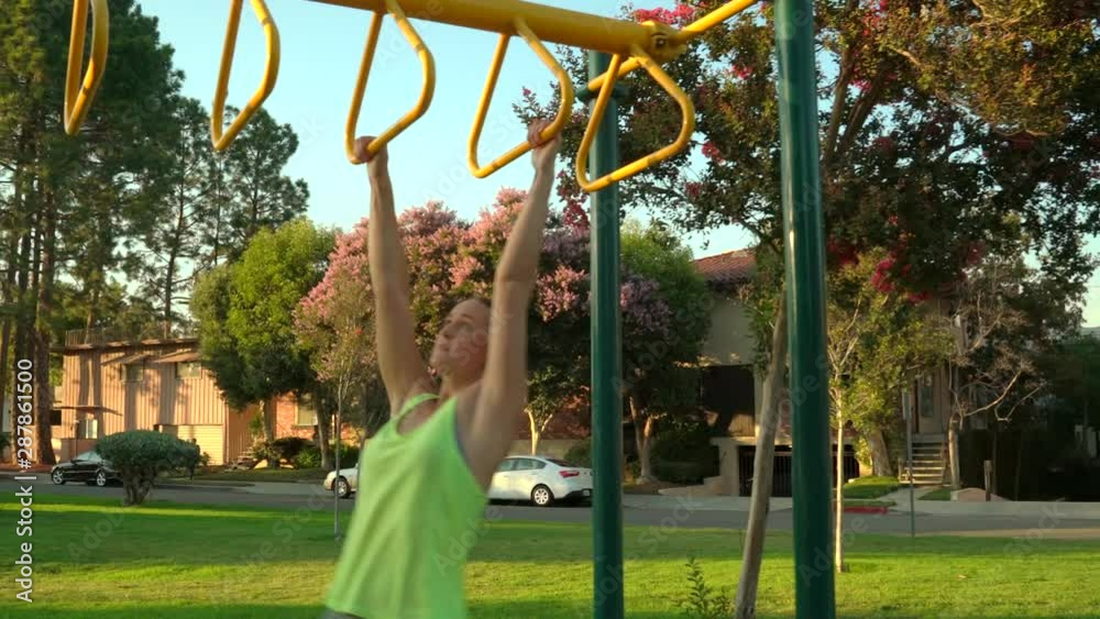 This video shows a side view of a fit caucasian woman athlete climbing ...