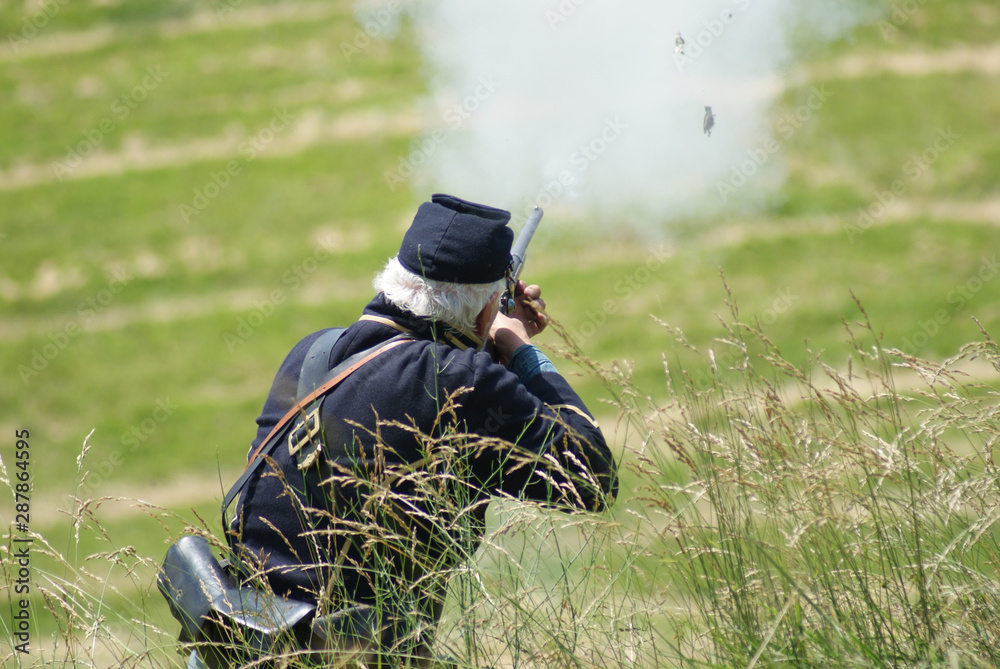 Civil War Soldier Firing a Rifle Stock Photo | Adobe Stock