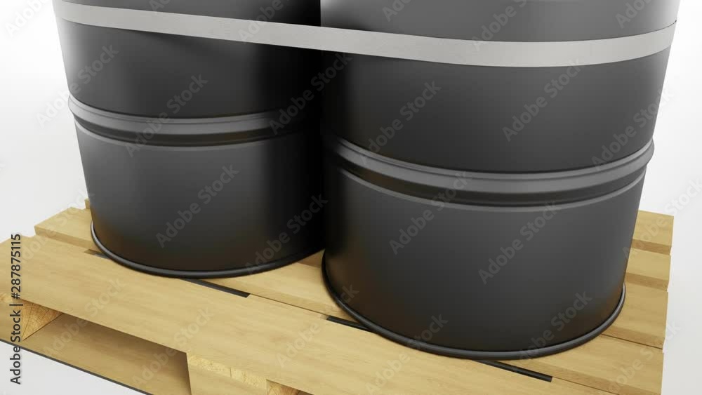 Close-up of two metal black barrels with oil symbol located on wooden ...