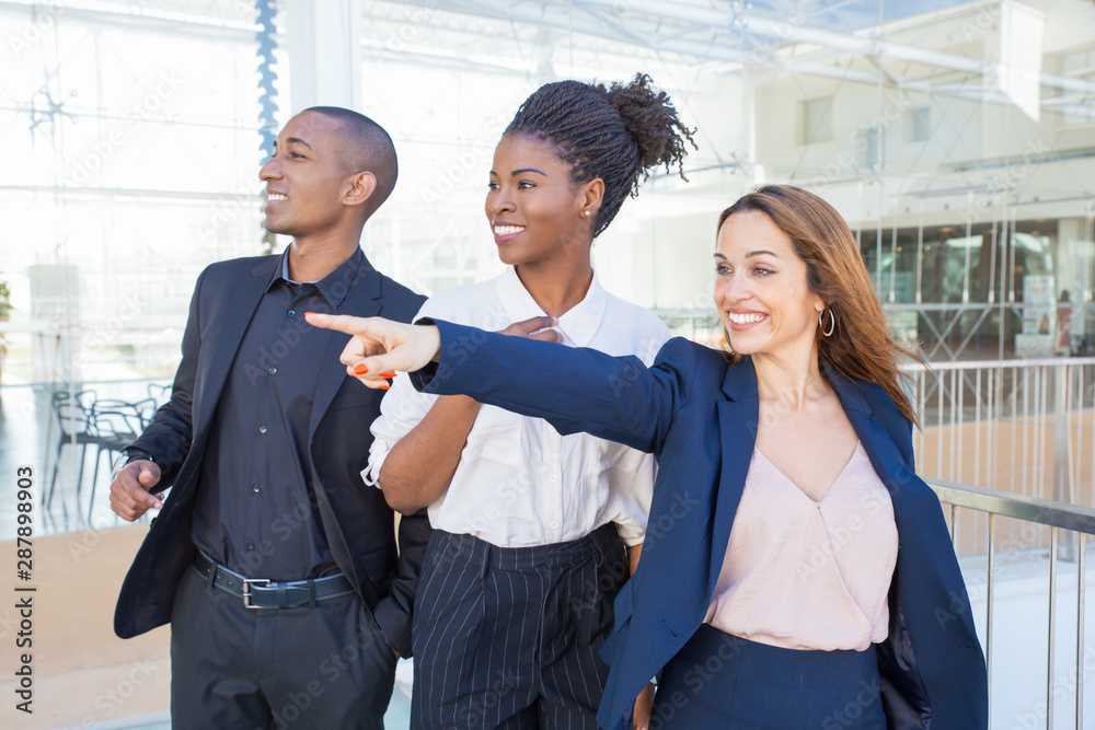 Excited multiethnic business people staring into distance. Business man ...
