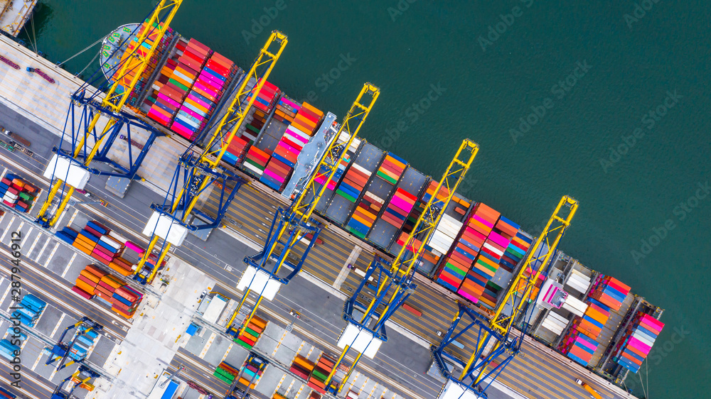 Container ship loading and unloading in deep sea port, Aerial top view ...