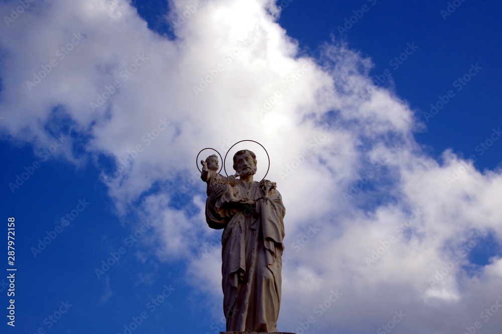 an old religious historical sculpture of Saint Joseph. monument San ...