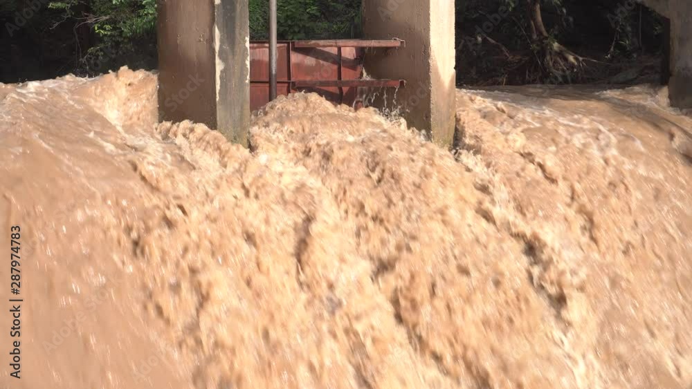 Dams or weir with strong and dangerous water flows After heavy rain on ...