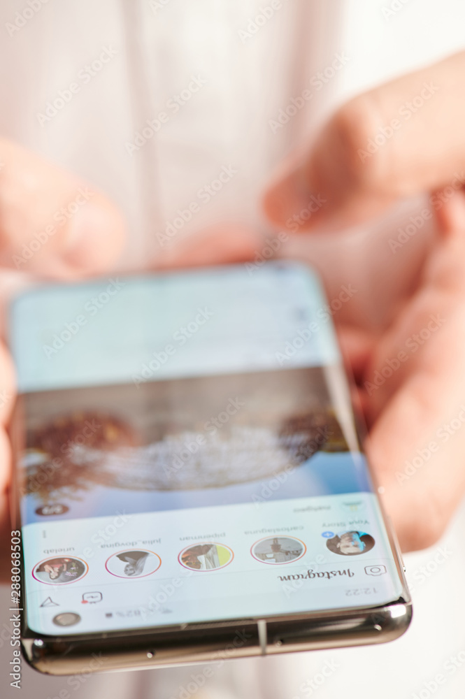 Using instagram mobile app Stock Photo | Adobe Stock